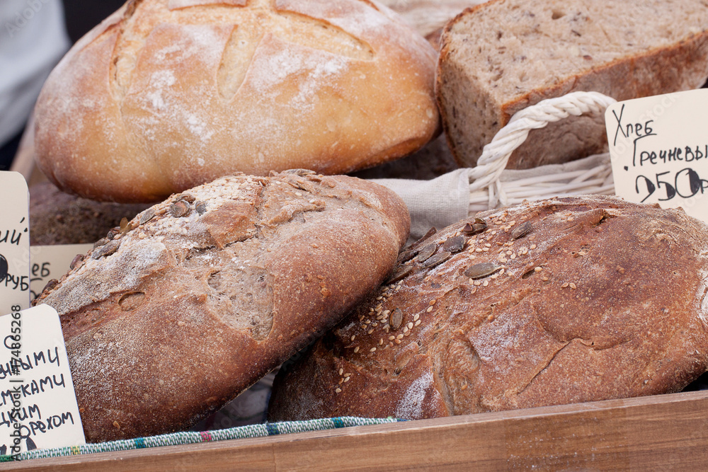 a few loaves, round loaves of bread in the shop window Stock Photo ...