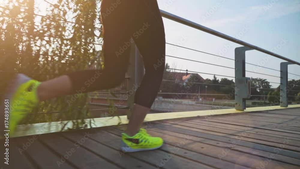 Runner woman feet in the city exercising outdoors. Slow Motion 4K ...