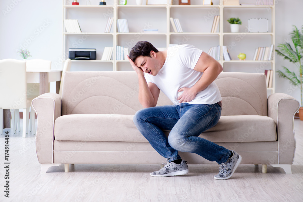 Man suffering from sick stomach and vomiting Stock Photo | Adobe Stock