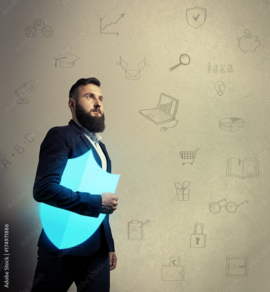 Bearded man in a business suit is holding a shield icon in his hands ...