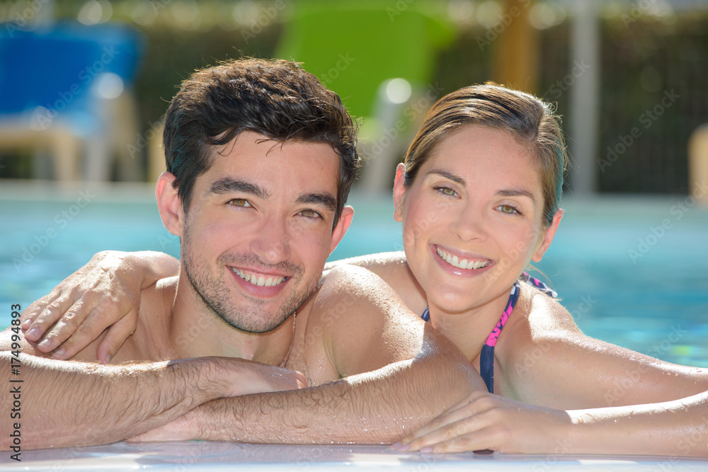couple in swimming pool Stock Photo | Adobe Stock