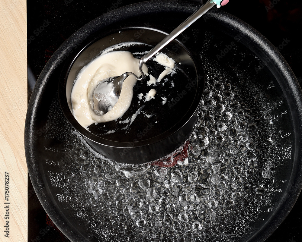 Chef cooking moon cake and mung bean pastry by double-boiling with ...