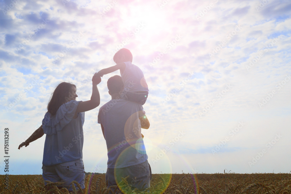 Happy family. Back view on the sunset. Stock Photo | Adobe Stock