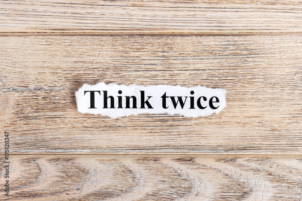 Think twice text on paper. Word Think twice on torn paper. Concept ...