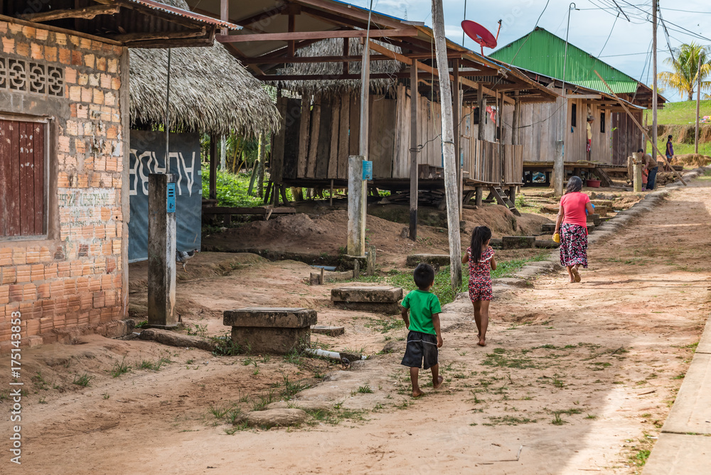 Children walking along dirt path in Amazon village Stock Photo | Adobe ...