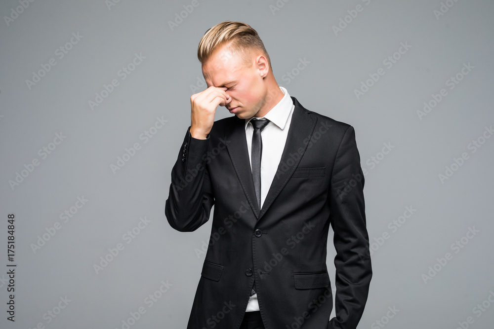 Side view portrait of sad man in formal clothes touching his nose ...