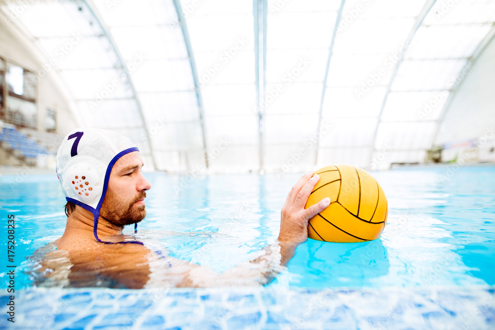 Water polo player in a swimming pool. Stock Photo | Adobe Stock