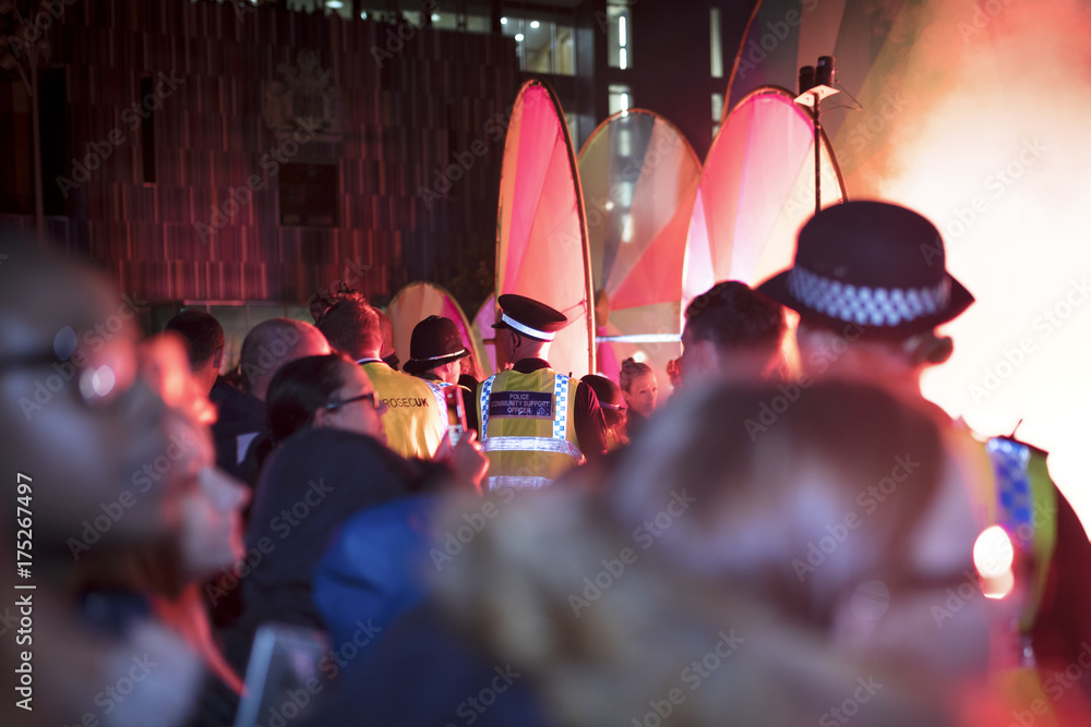 Police monitor a crowd at a festival in the UK Stock Photo | Adobe Stock