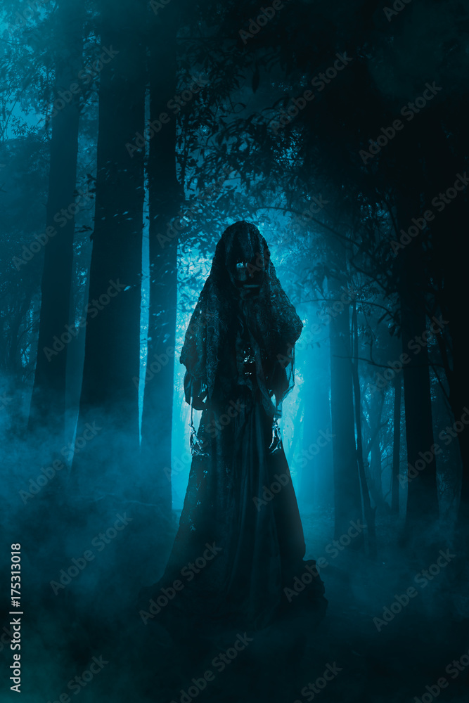 scary ghost lurking in the woods / high contrast image Stock Photo ...