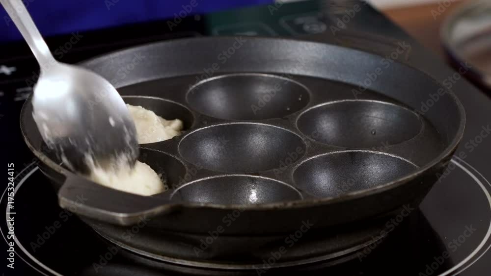 Traditional Indian Dish Cooking in a Paniyaram Pan-Closeup Shot Stock ...