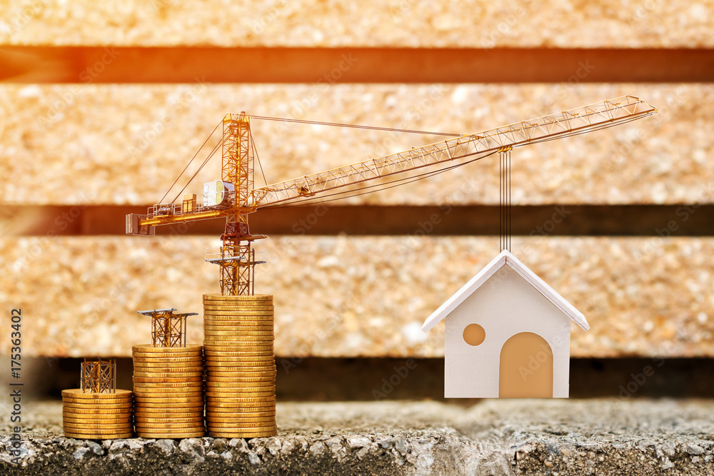 Stacking gold coins with increase and tower crane and hoist brake ...