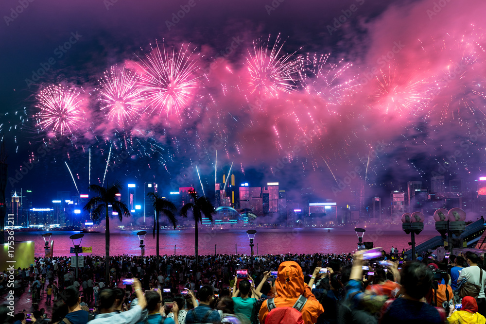 The crowd watching national day fireworks display in rain at waterfront ...