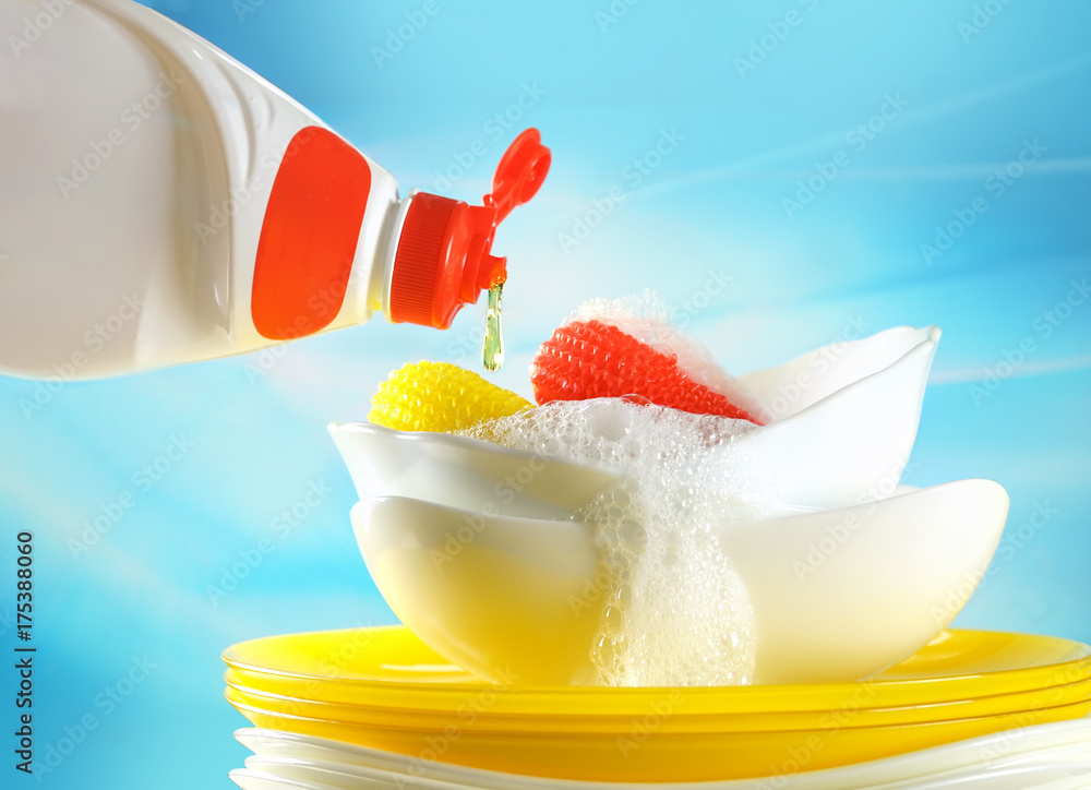 Concept washing-up. Liquid detergent for washing dishes. A drop of ...