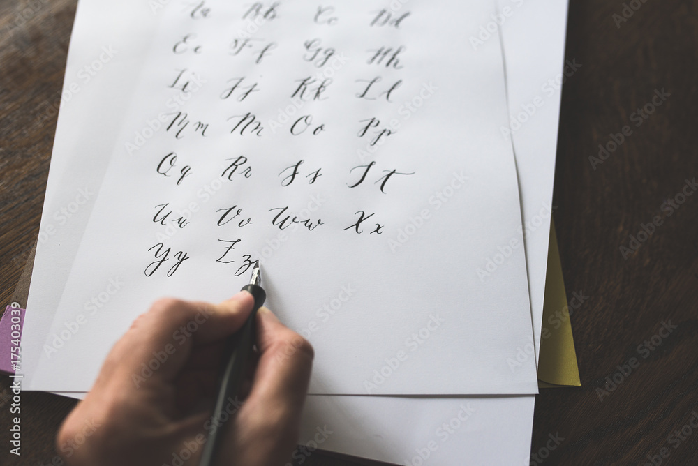 A Left Handed Person Writes The Alphabet With A Straight Calligraphy ...