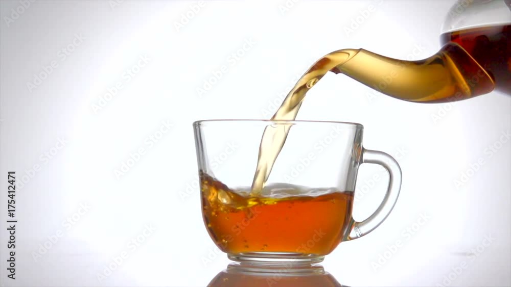 Vidéo Stock Tea pouring. Transparent glass teapot and teacup. 4K UHD ...