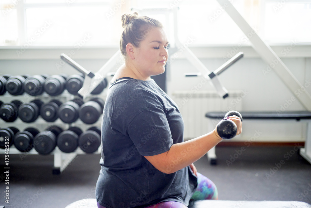 Fat girl in a gym Stock Photo | Adobe Stock