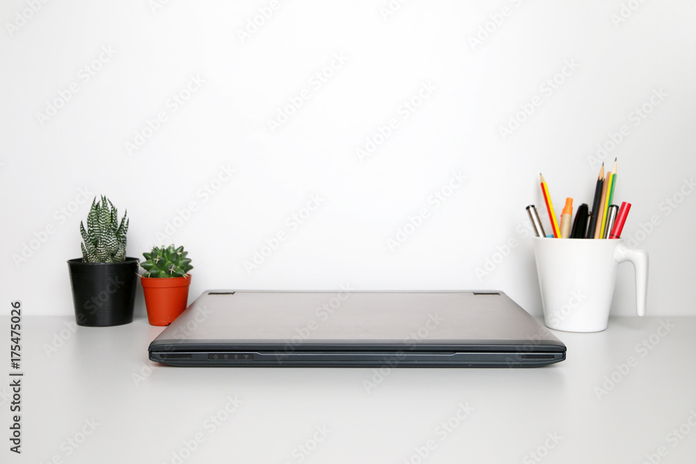 laptop computer closed on desk at office Stock Photo | Adobe Stock