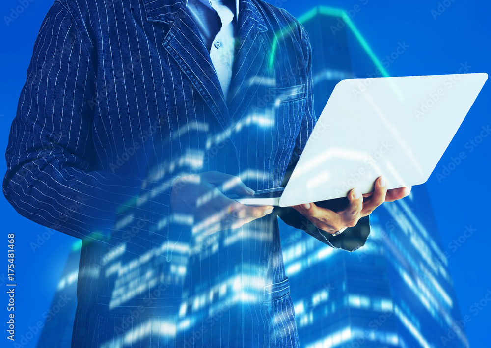Multiple exposure of business man is handling laptop with office ...