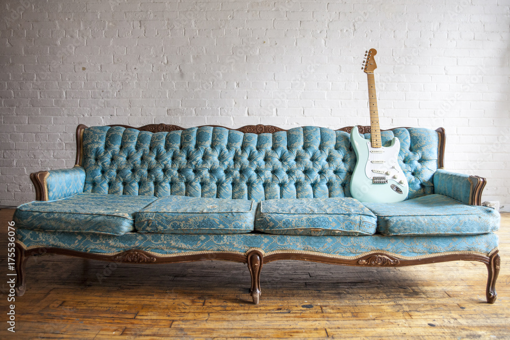 vintage blue couch with vintage blue guitar Stock Photo | Adobe Stock
