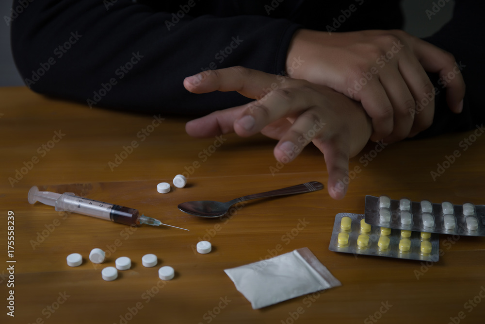 man substance dependence medication Drug syringe and cooked heroin ...