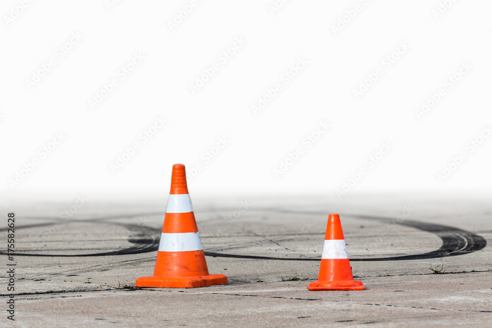 Signal cone orange on the race track grey with tire tracks. Stock Photo ...