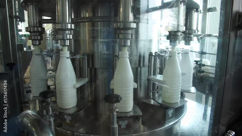 The process of milk bottling in a dairy factory Stock Video | Adobe Stock