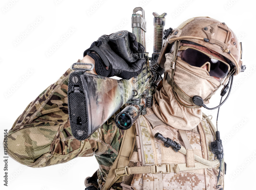 Half length low angle studio shot of special forces soldier in field ...