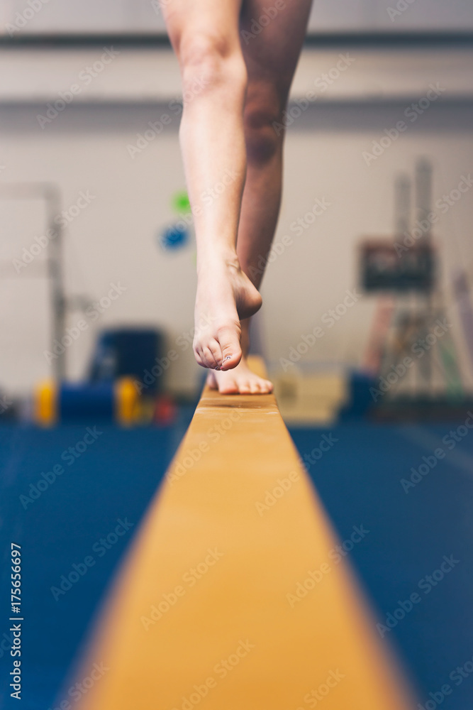 Gymnastics: Girl Pointing Toes On Balance Beam Stock Photo | Adobe Stock