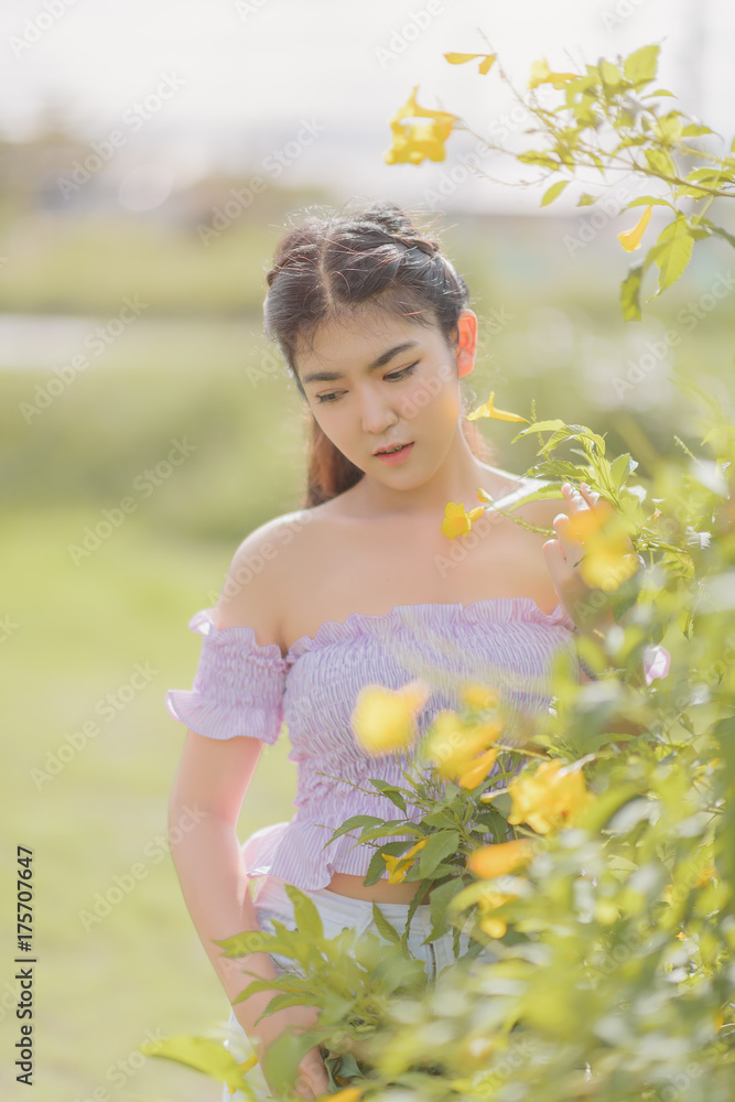 Beautiful asian young woman outdoors in a forest. Pretty Thai girl in ...