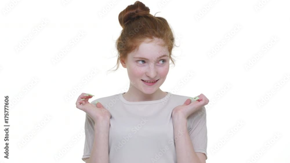 caucasian playful beautiful girl with tied ginger hair in topknot ...