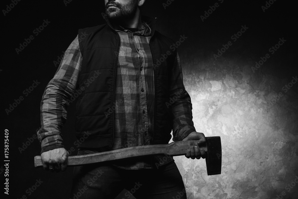 Confident axeman. Armed man with axe. Dangerous unrecognizable rural ...