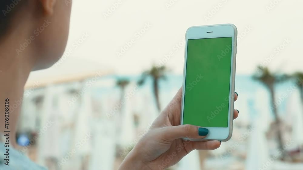 Closeup woman young holding hand using smart phone unrecognisable face ...