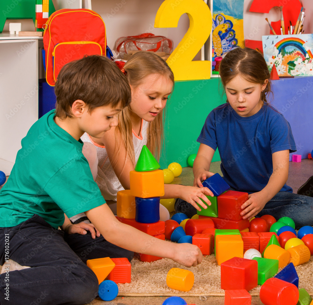 Children playing in kids cubes indoor. Lesson in primary school. Body ...