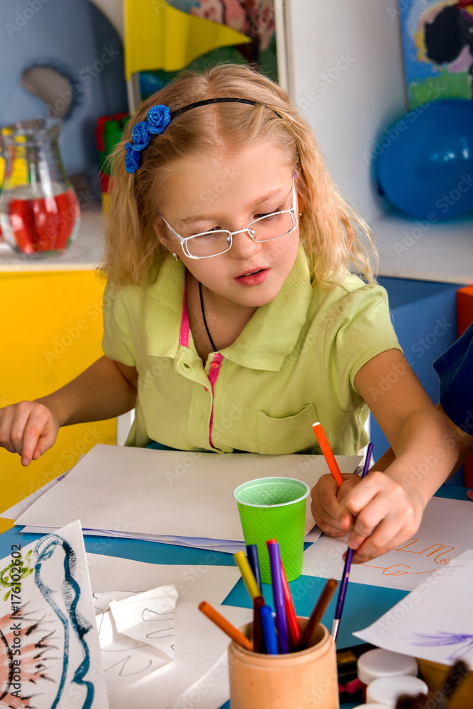 Small students painting in art school class. Child drawing by paints on ...