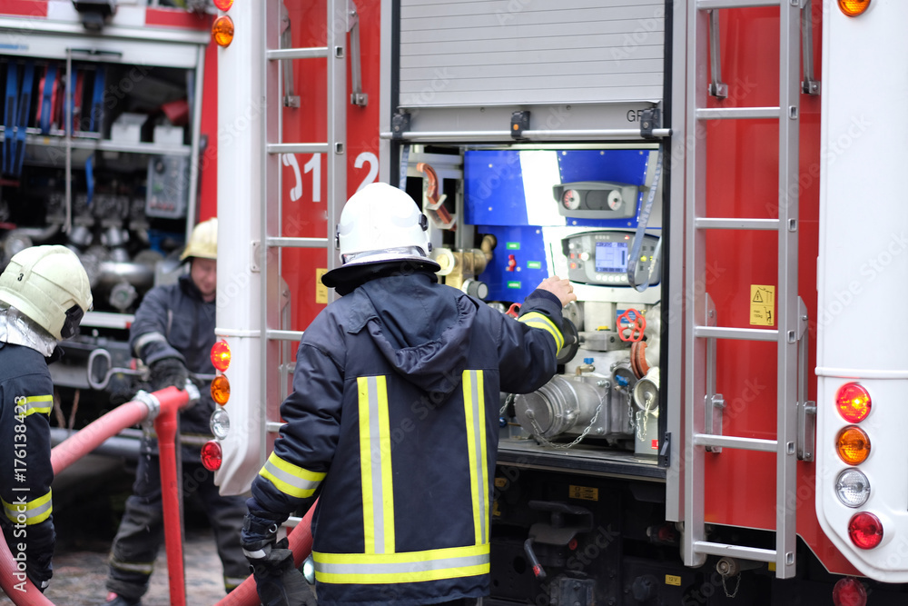 Brigade firefighters deploys equipment for fire extinguishing Stock ...