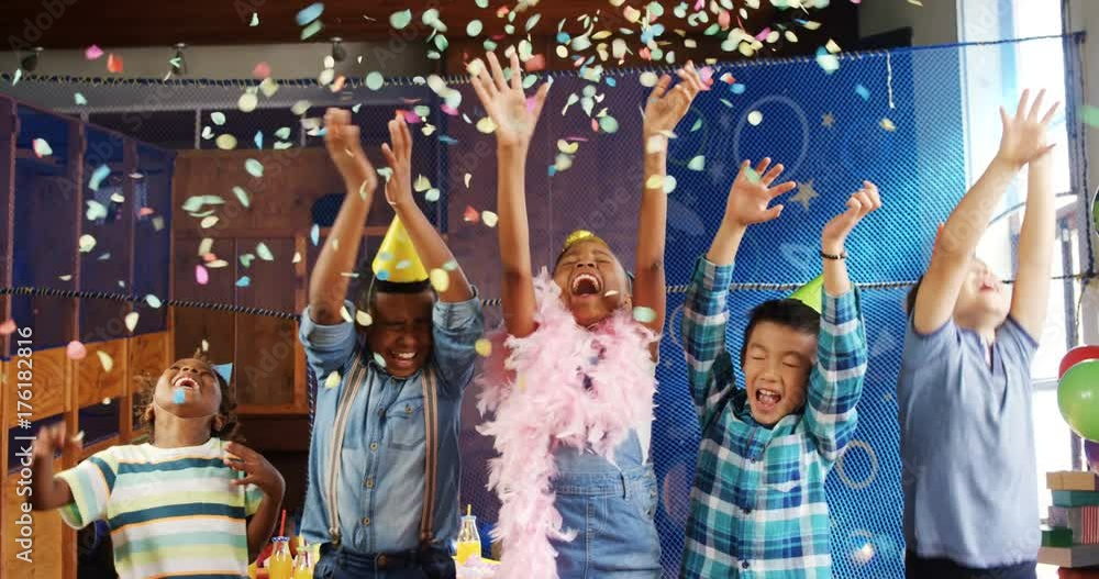 Mixed-race and African American kids having fun during birthday party ...