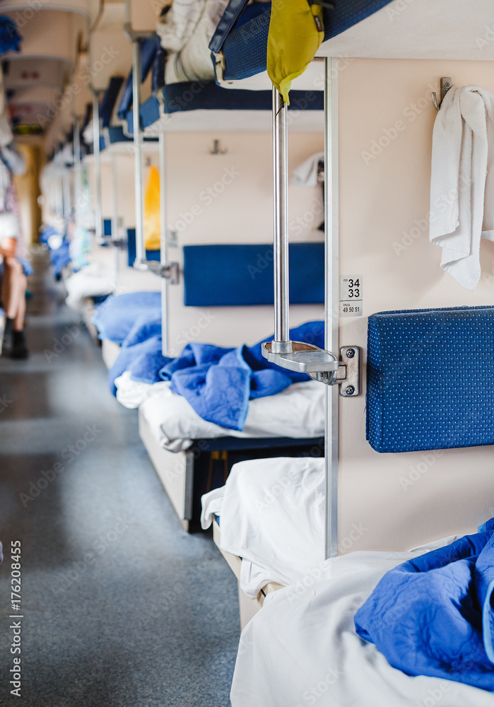 Interior of a typical russian long-distance train with beds for ...