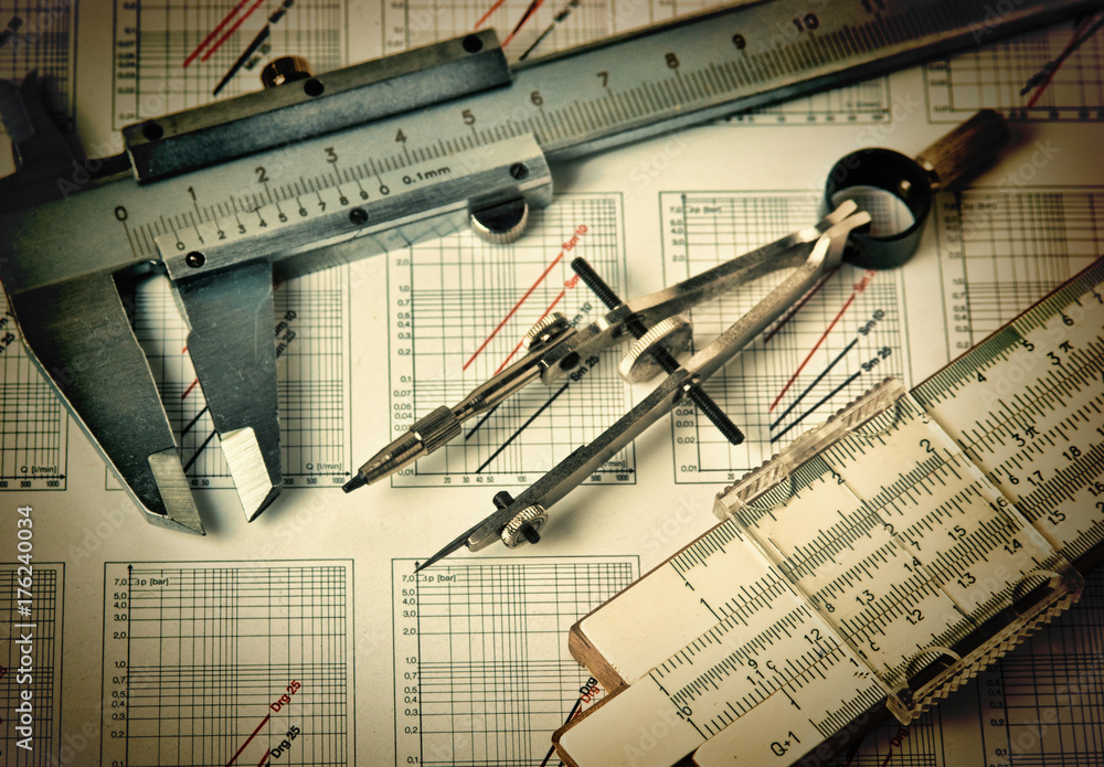 Old engineering tools on a technical drawing Stock Photo | Adobe Stock