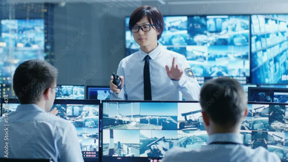 In the Security Control Room Chief Surveillance Officer Holds a Meeting ...