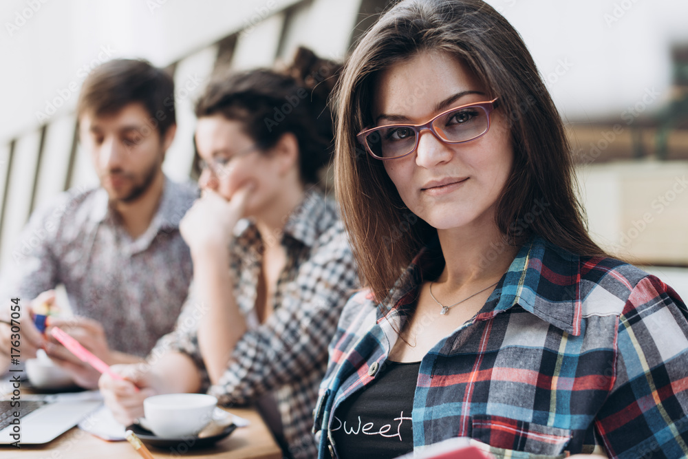 Young smart people are using gadgets while studying in the modern ...