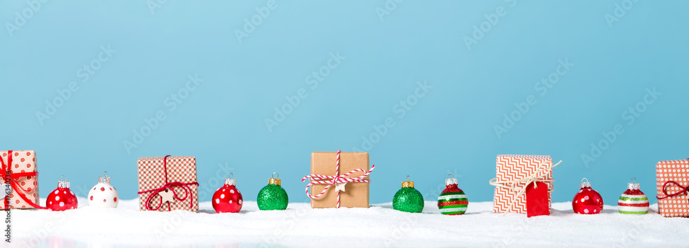 Collection of Christmas gift boxes in a snow covered landscape Stock ...