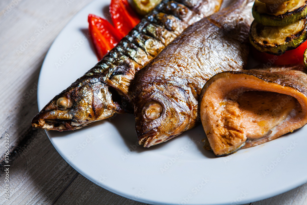 Assortment of fried fasting fish, Mackerel, trout, carp. Top view on ...