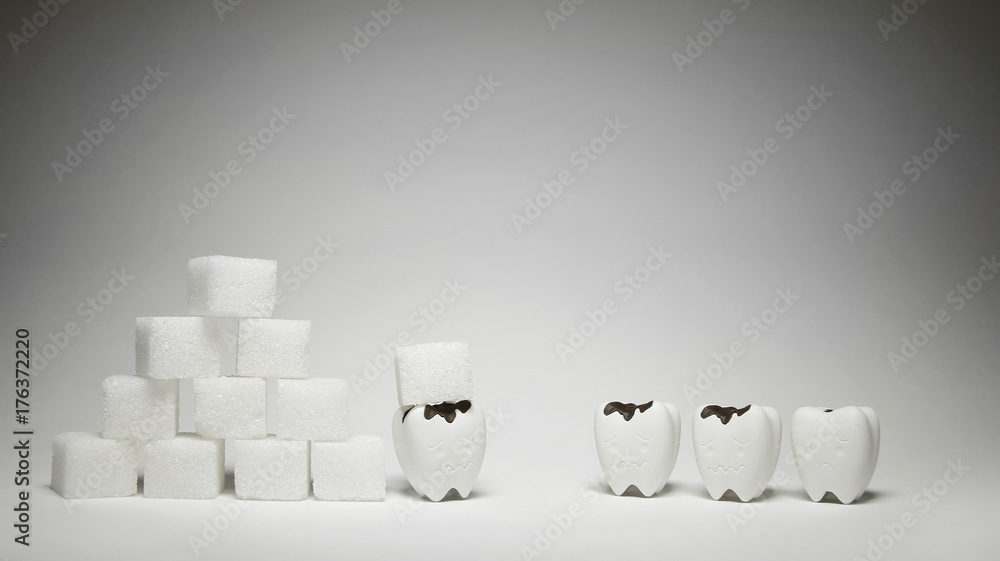 Decayed teeth Model in bad and sad emotion have sugar put on top with ...
