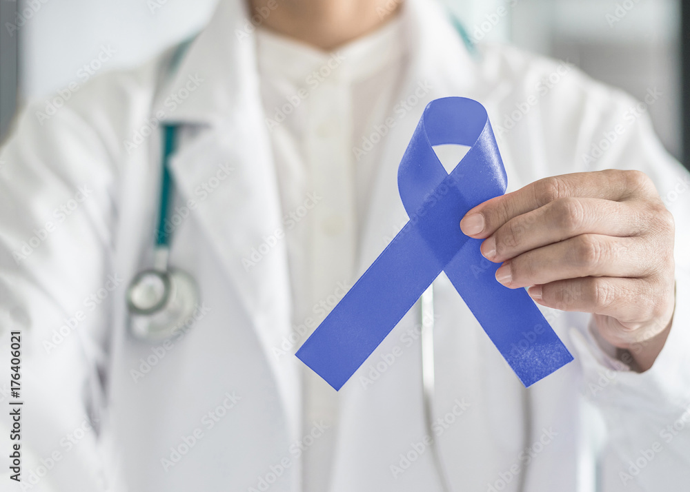 Periwinkle blue ribbon awareness with color bow on medical doctor's ...