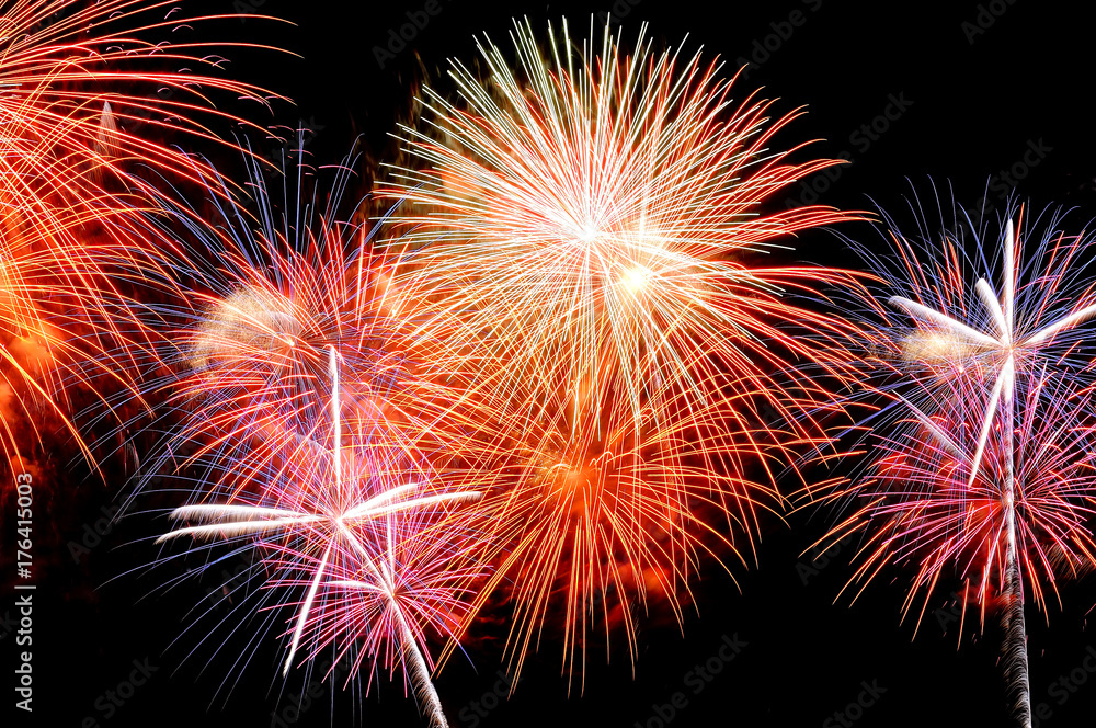 Red, white and pink fireworks display on dark sky background Stock ...