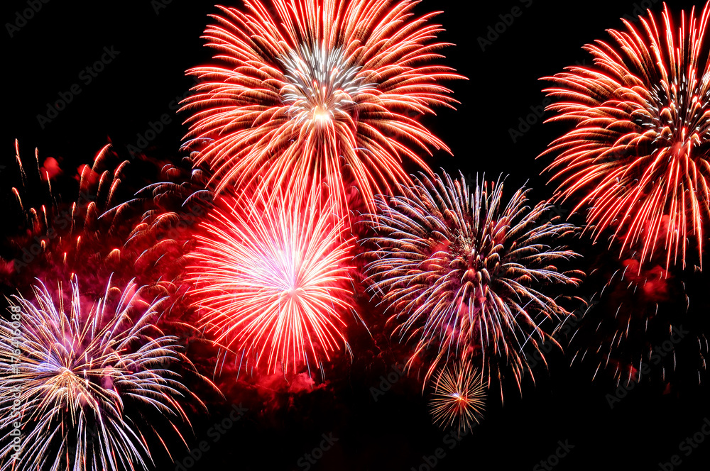 Amazing red and blue fireworks on black background Stock Photo | Adobe ...