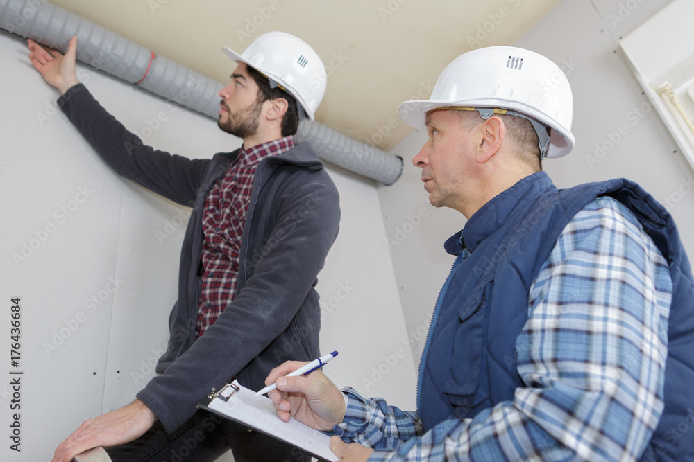 contractor manager inspecting the works done Stock Photo | Adobe Stock