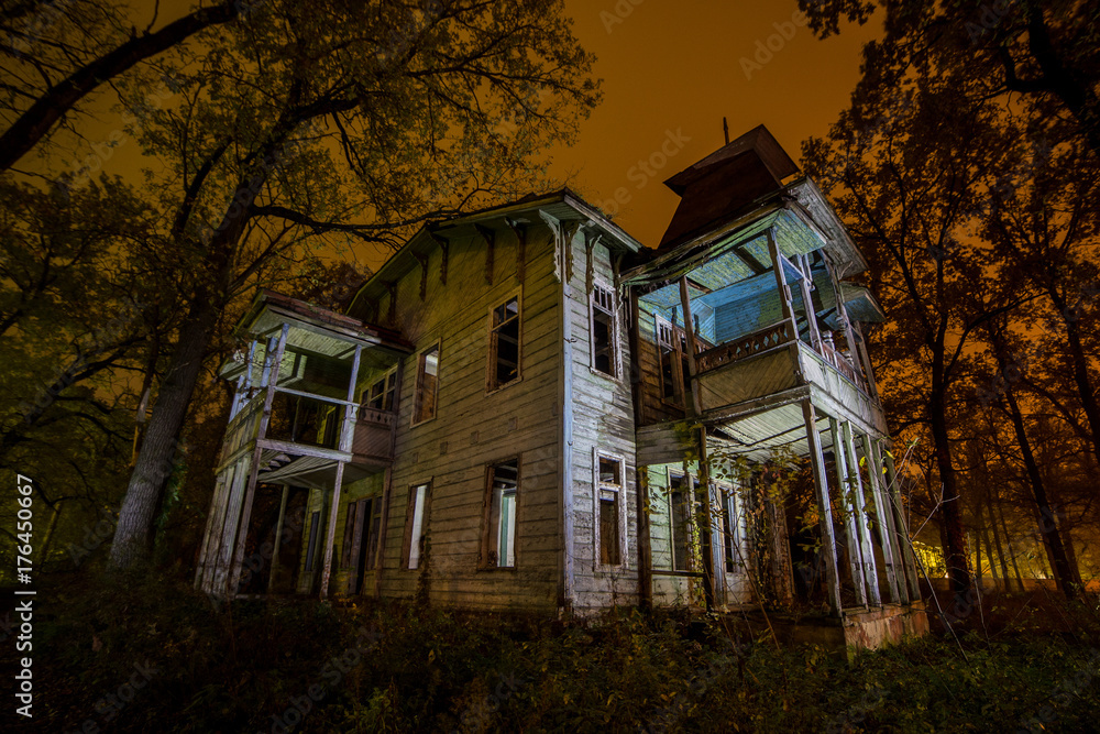 Old creepy wooden abandoned haunted mansion at night Stock Photo ...