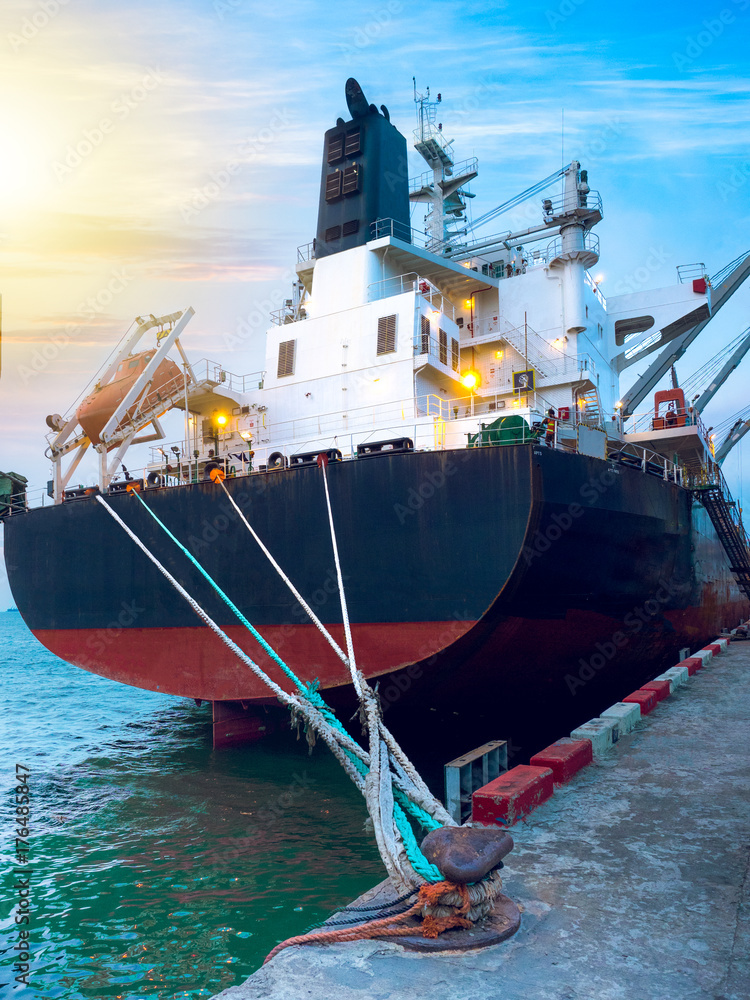Vessel alongside by mooring rope connect with bollard at port of ...