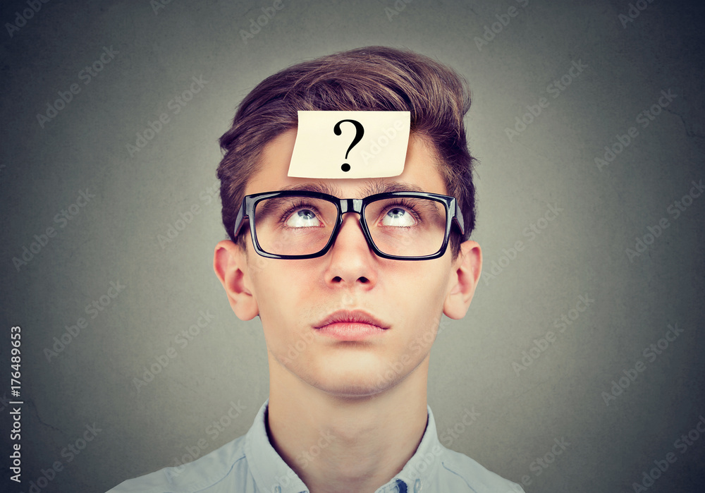 thinking man with question mark looking up Stock Photo | Adobe Stock